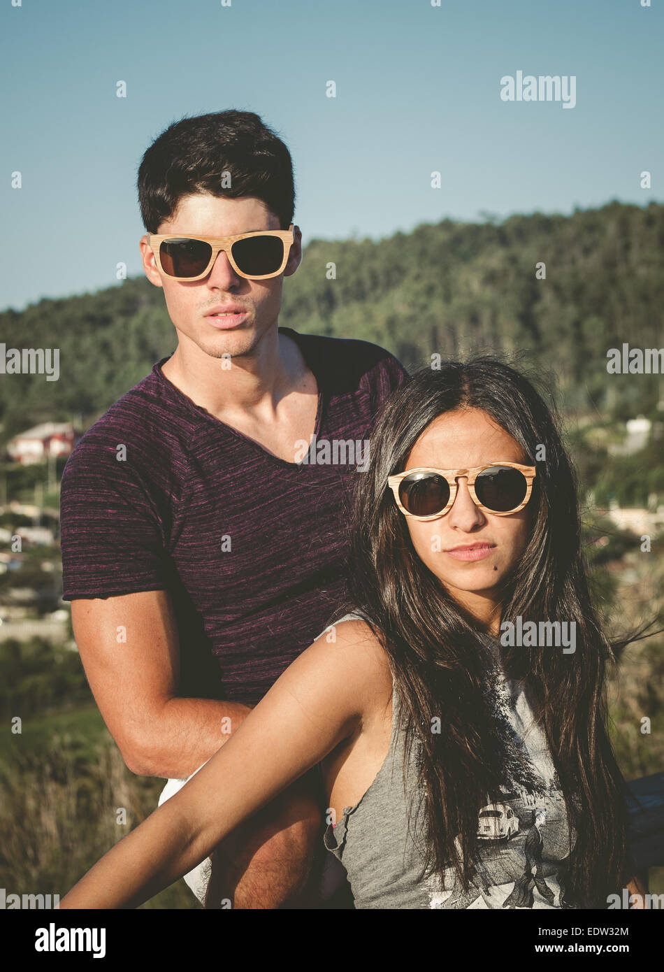 Model couple in a portrait outdoors. Couple is using sunglasses Stock ...