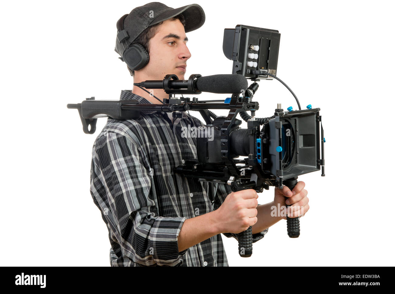 young cameraman with movie camera on the white background Stock Photo ...