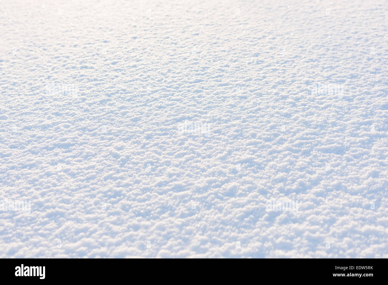 Morning sunshine frozen snow field background Stock Photo - Alamy
