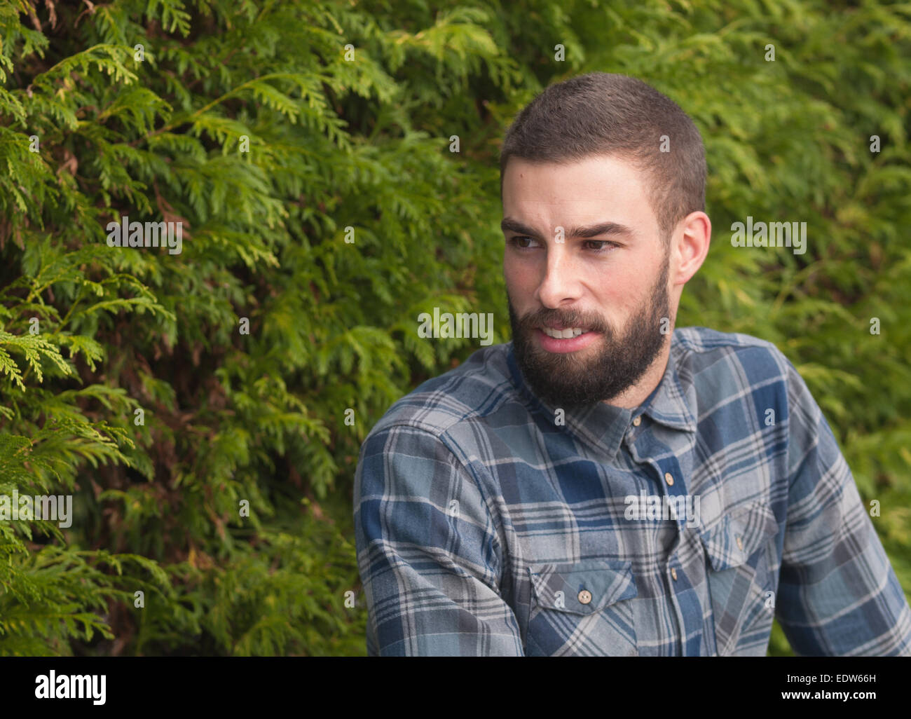 Hipster man looking aside in a park outdoors Stock Photo - Alamy