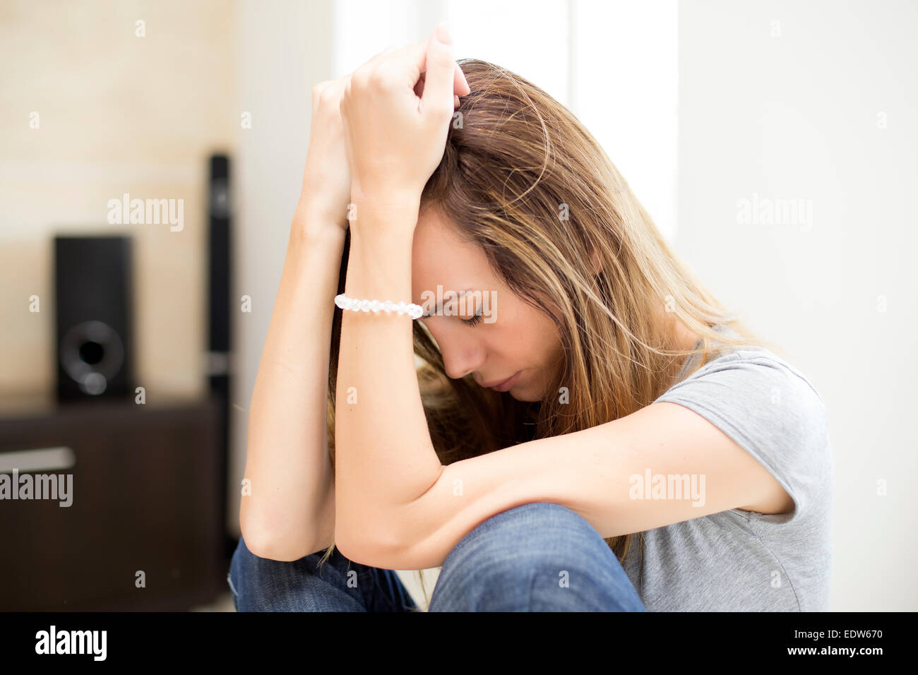 Sad woman in the room Stock Photo - Alamy