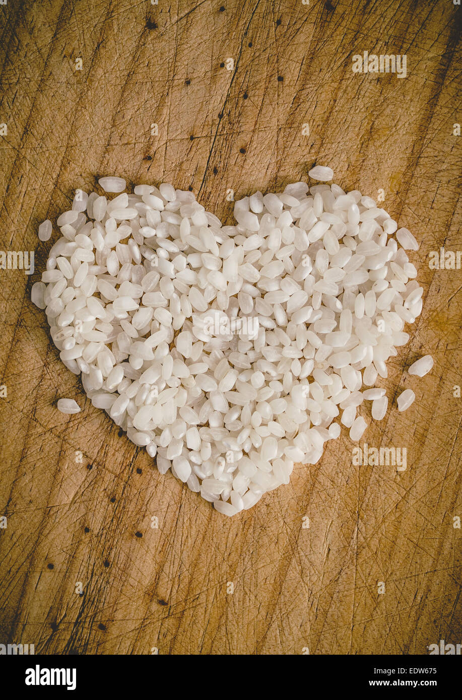 Rice heart on wooden background in a studio shot Stock Photo - Alamy