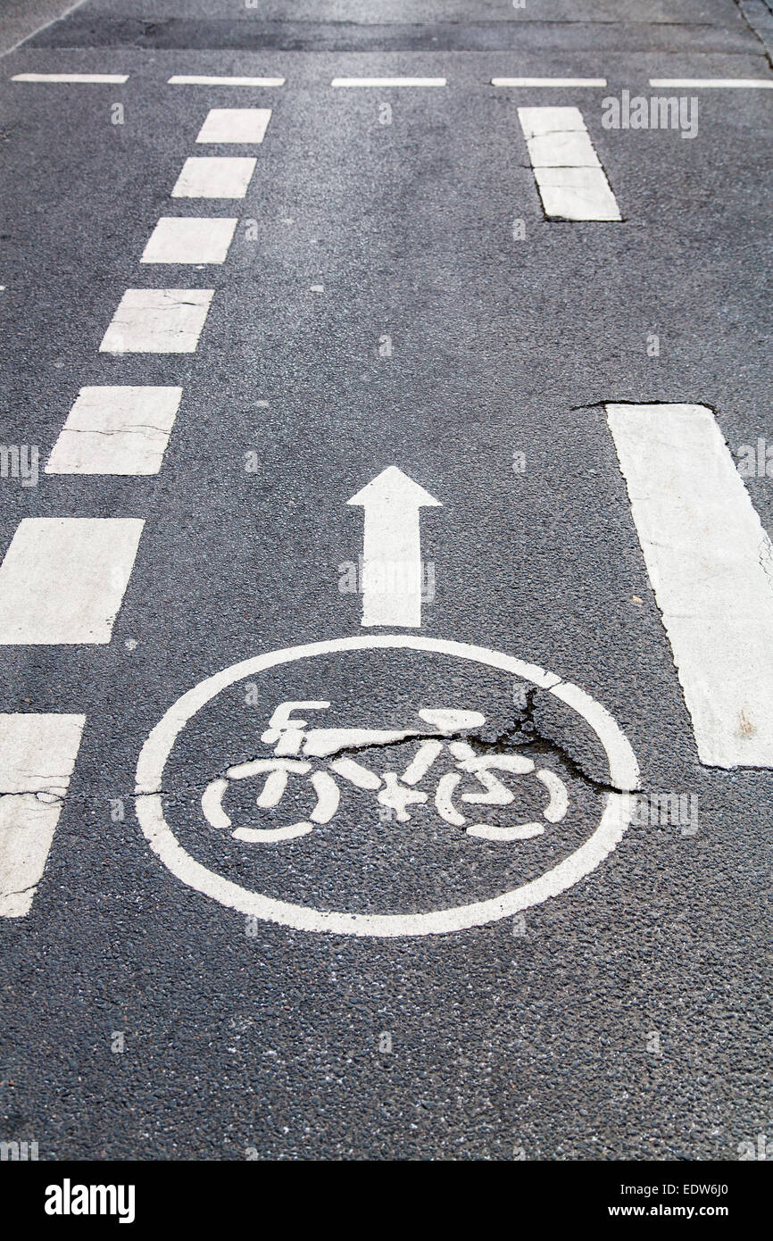 Traffic signs for bike path, painted on the pavement, worn Stock Photo ...