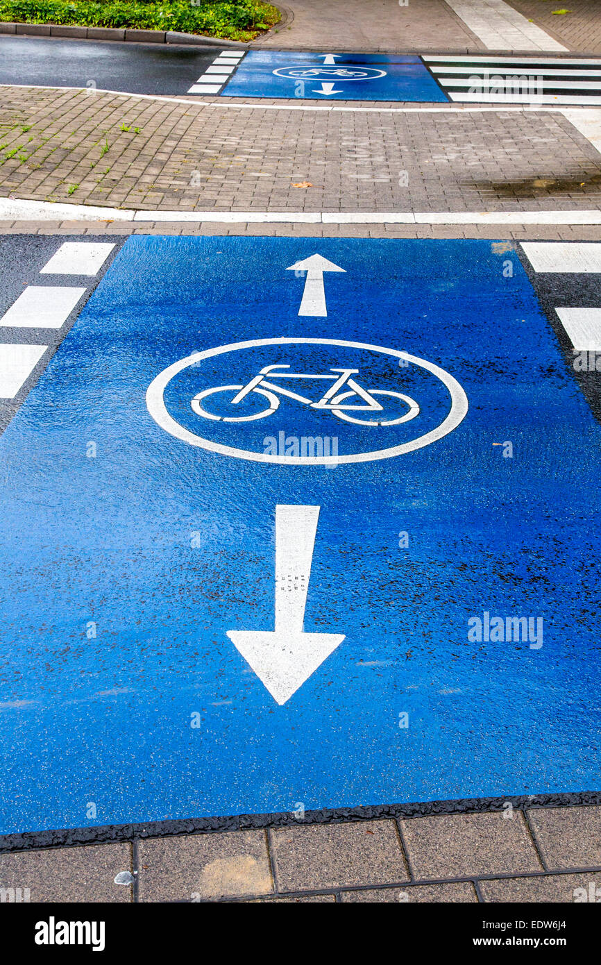 Traffic signs for bike path, painted on the pavement, worn Stock Photo ...