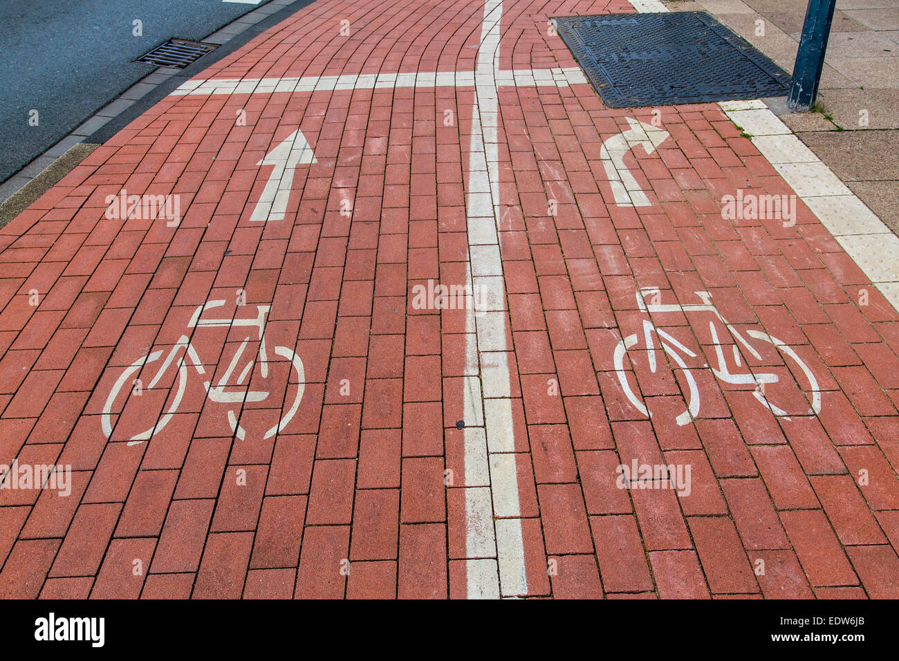 Traffic signs for bike path, painted on the pavement, worn Stock Photo ...