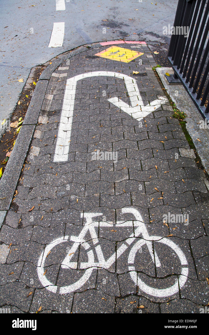 Traffic signs for bike path, painted on the pavement, worn Stock Photo ...