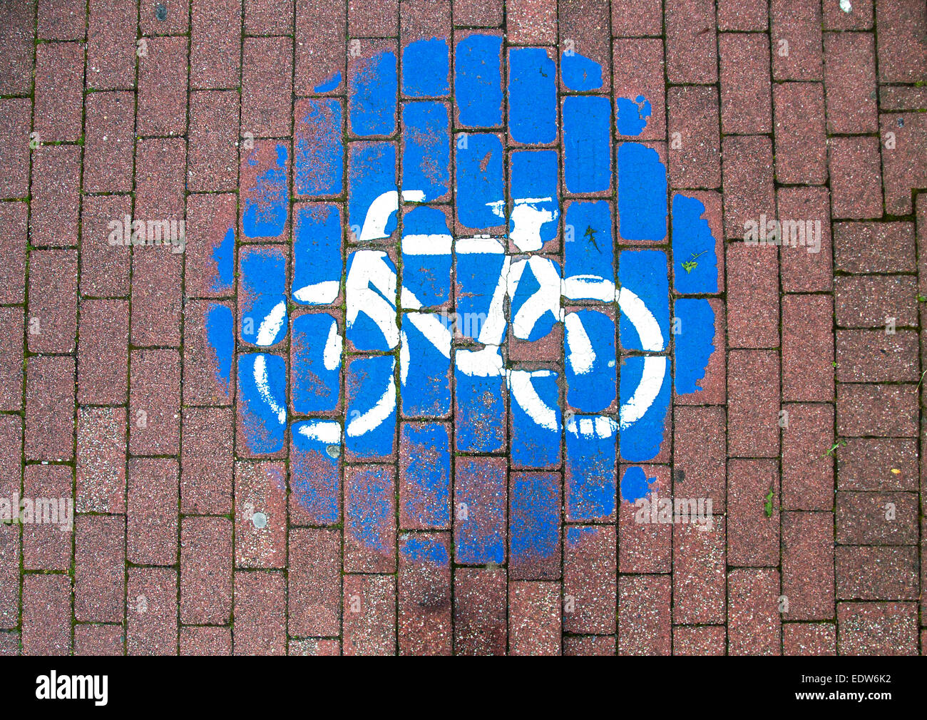 Traffic signs for bike path, painted on the pavement, worn Stock Photo ...
