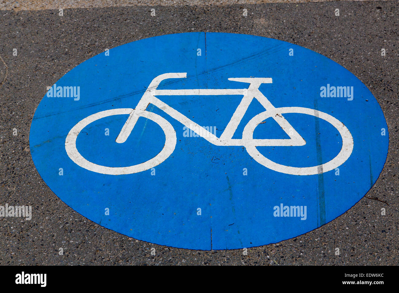 Traffic signs for bike path, painted on the pavement, worn Stock Photo ...