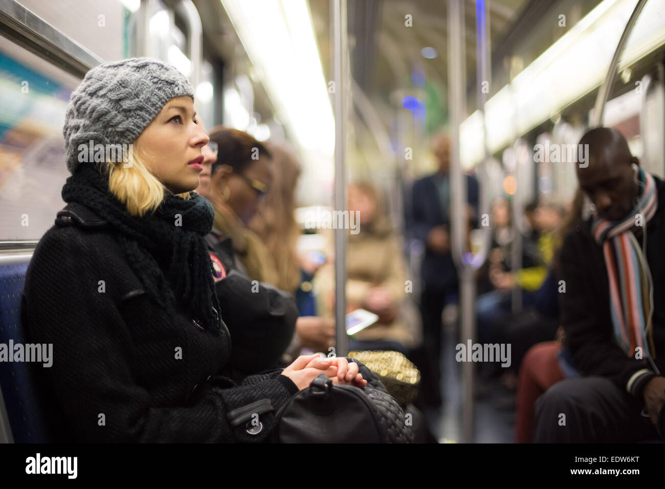 Woman on crowded tube train hi-res stock photography and images - Alamy