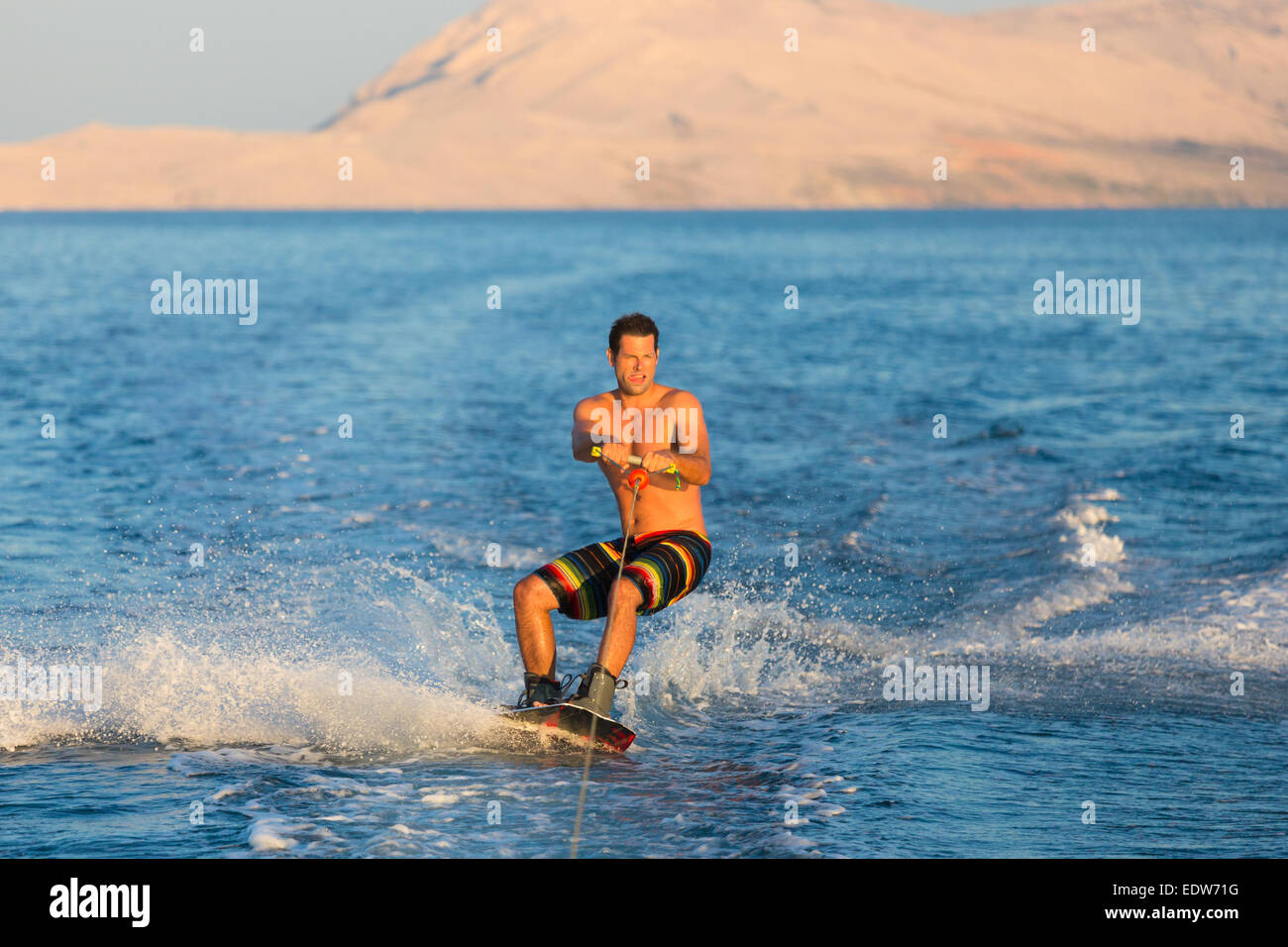 Wakeboarder in sunset Stock Photo - Alamy