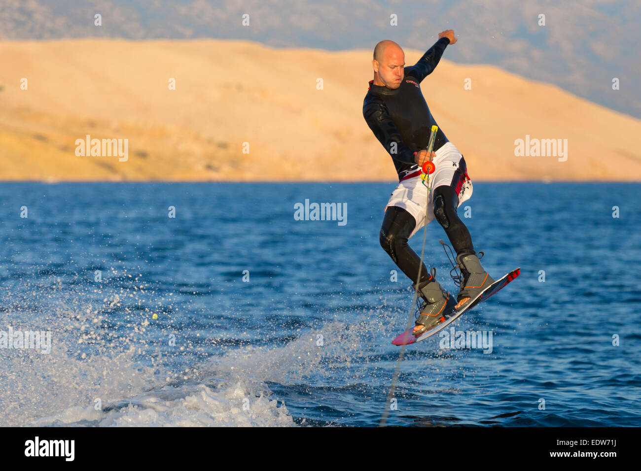 Wakeboarder in sunset Stock Photo - Alamy