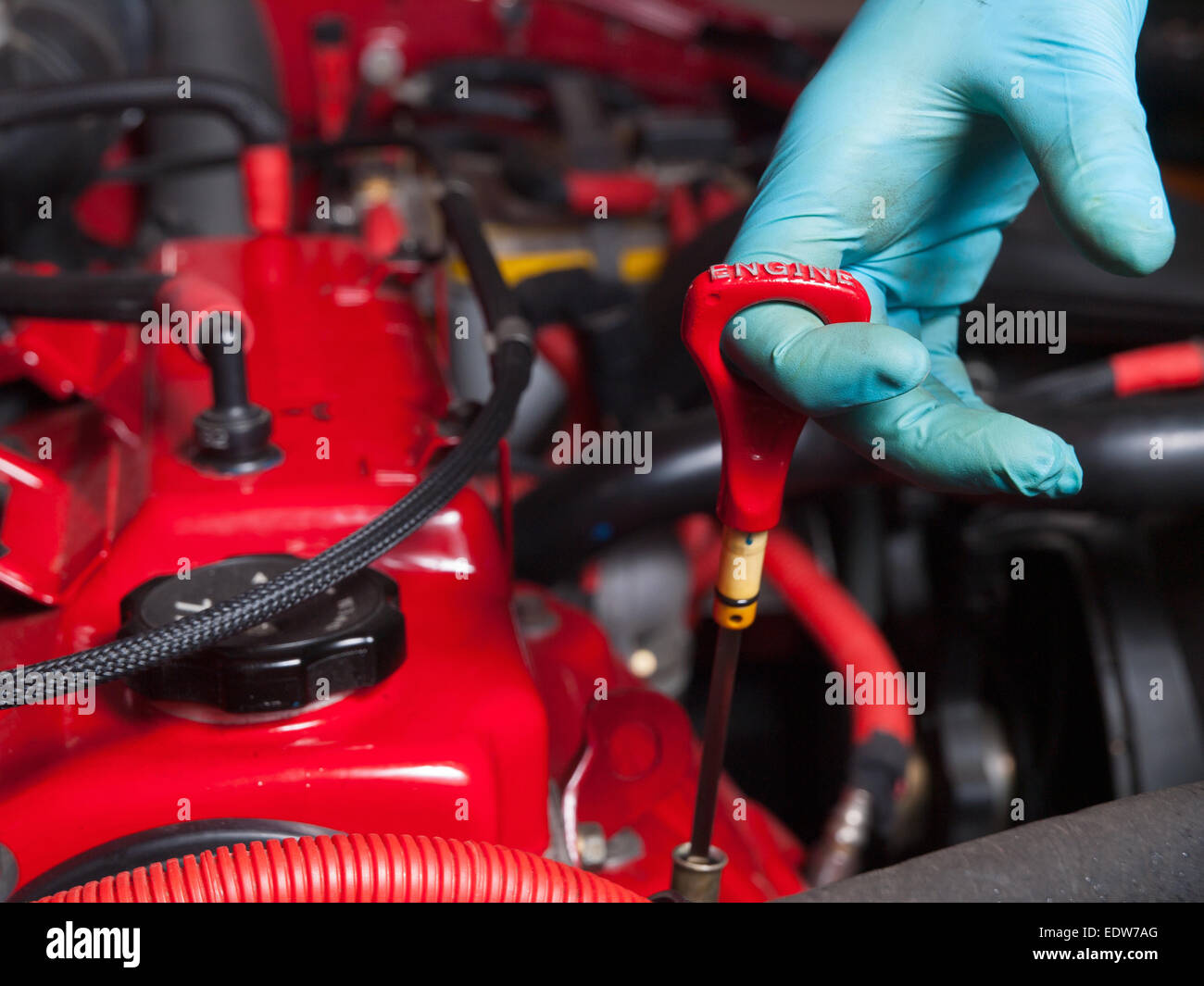 Checking the oil hi-res stock photography and images - Alamy