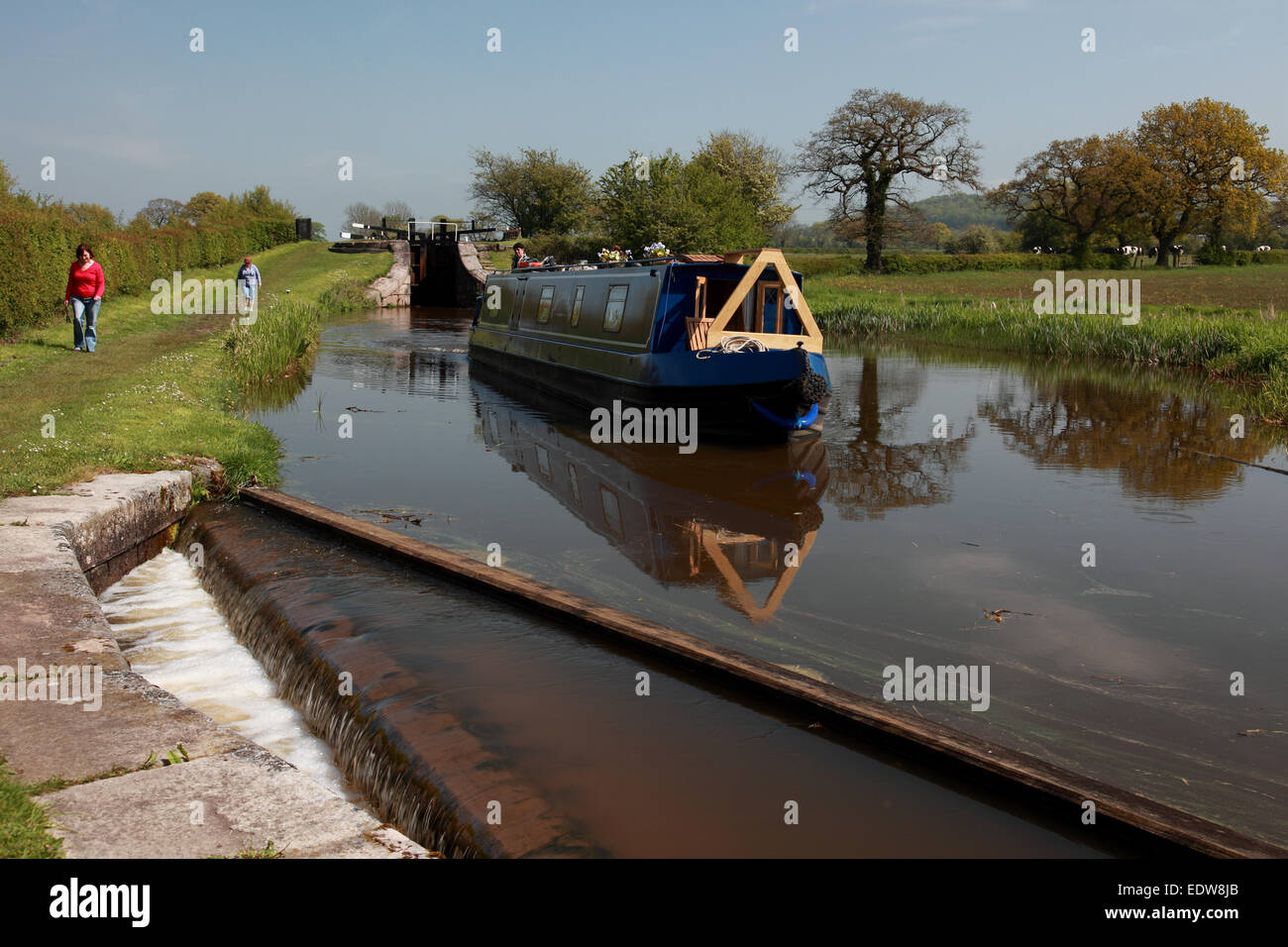 A narrowboat approaching lock 3 of the Bosley flight on the ...