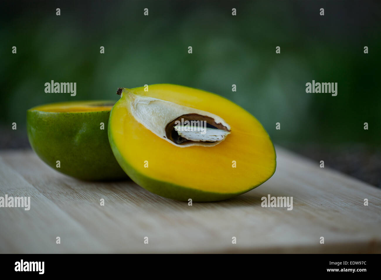Mango halves hi-res stock photography and images - Alamy