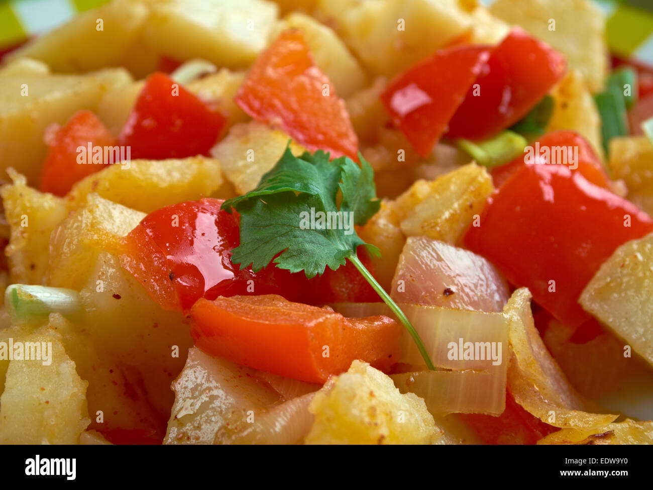 Potatoes O'Brien - dish of pan-fried potatoes along with green and red ...