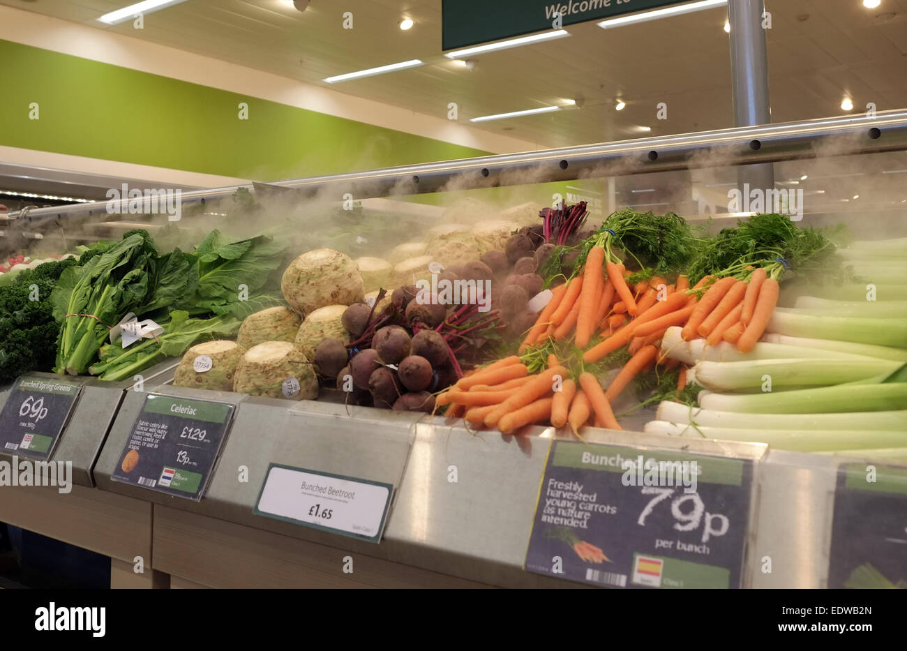 Supermarket produce on sale being chilled with cold vapor stream Stock ...