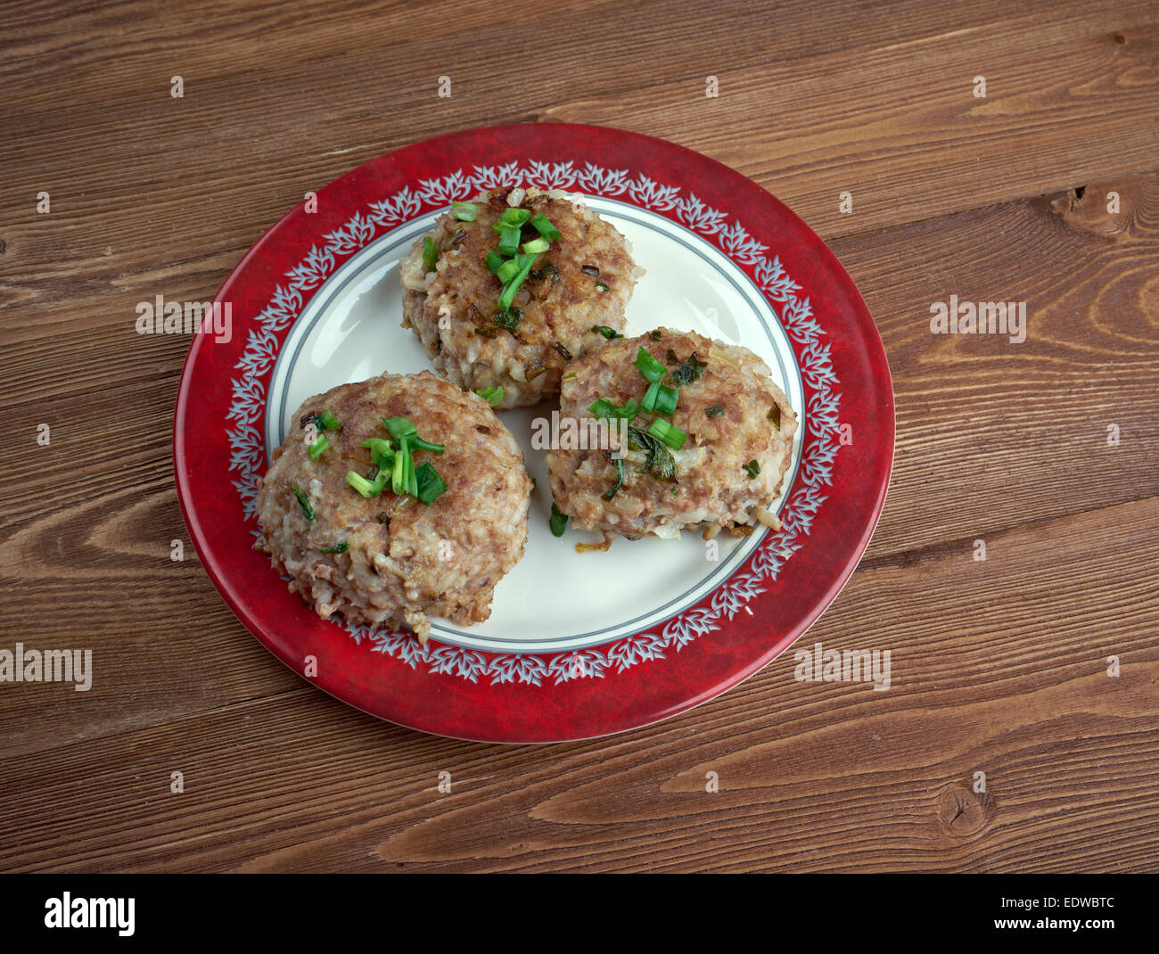 Dry meatballs with green onions. close up Stock Photo - Alamy