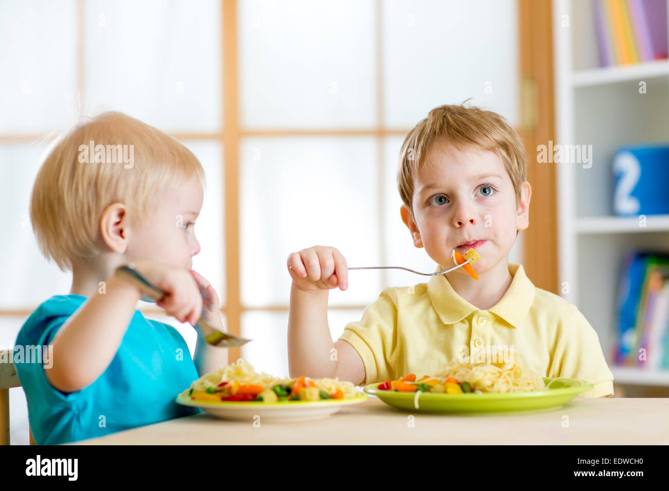 kids eating in kindergarten or at home Stock Photo - Alamy