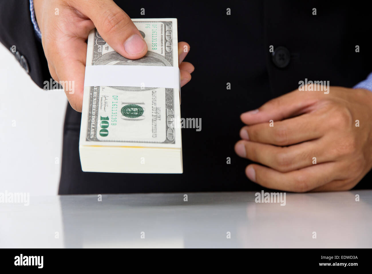 image of hand giving money Stock Photo - Alamy