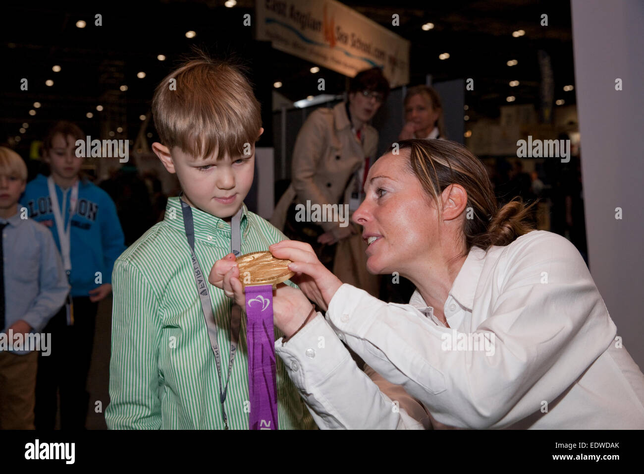 Paralympic Gold medallist Helena Lucas shows her Gold medal to Elliot ...