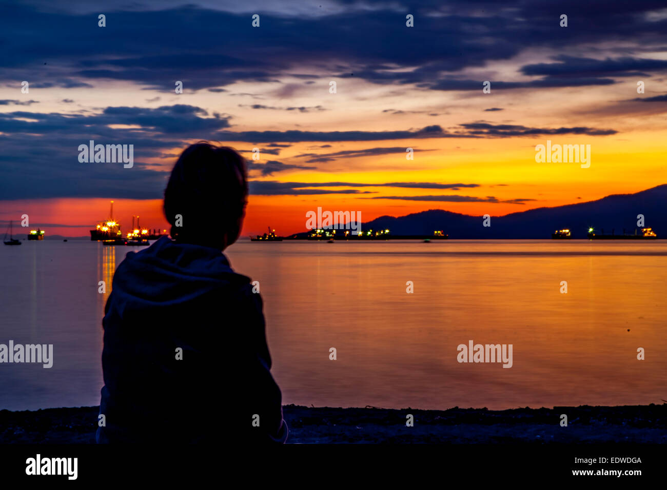 Watching the sunset Stock Photo - Alamy