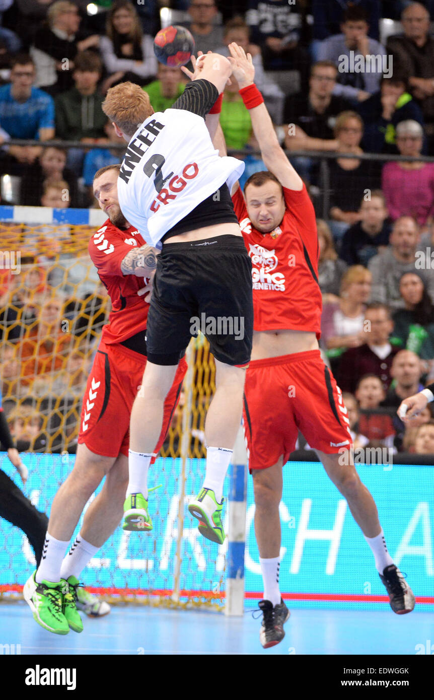 Stuttgart, Germany. 9th Jan, 2015. Germany's Stefan Kneer (C) vies for ...