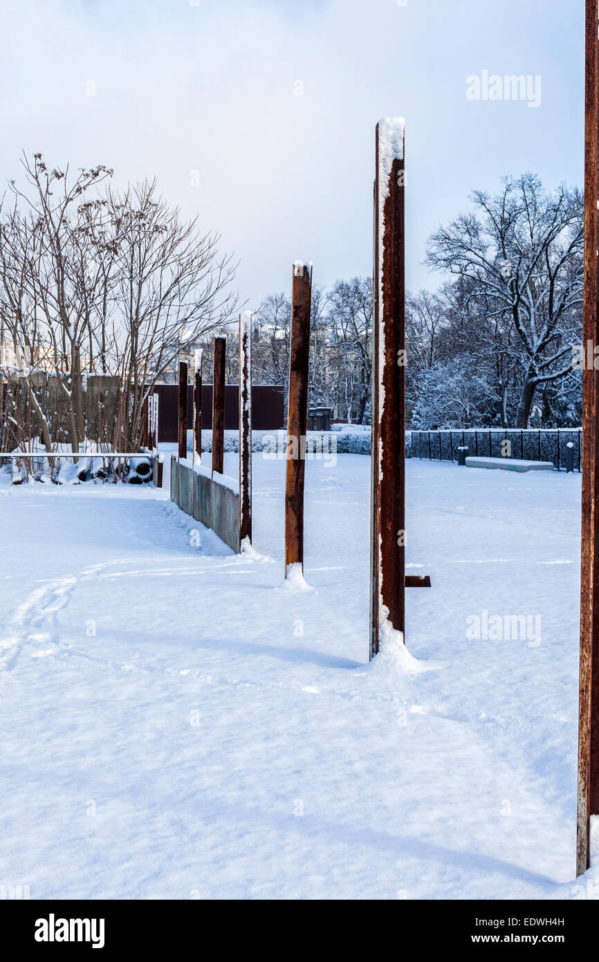 The Berlin Wall Memorial after snow in Winter. Rusty poles and wall ...