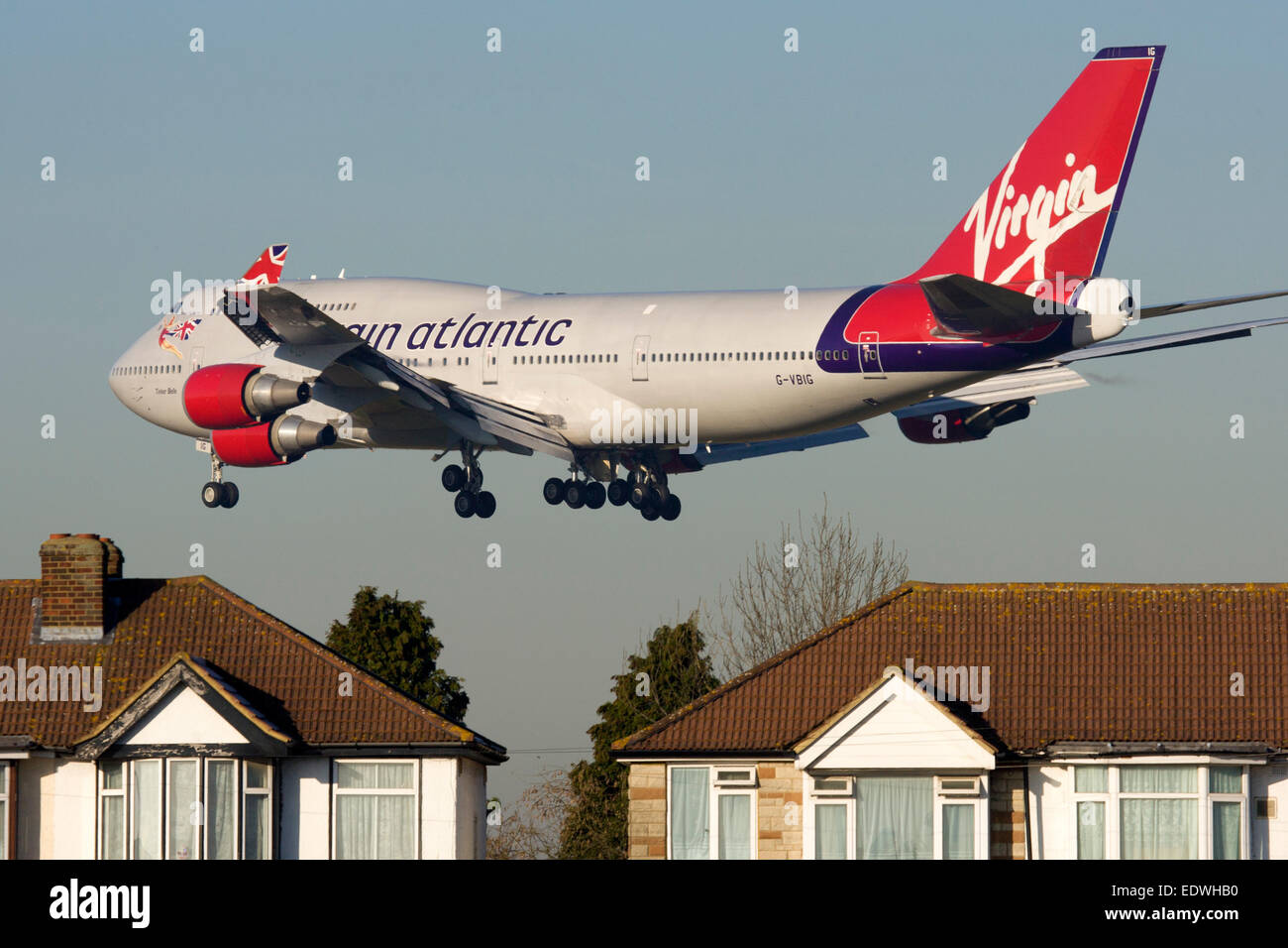 A Virgin Atlantic Boeing 747 lands over houses at London Heathrow Stock ...
