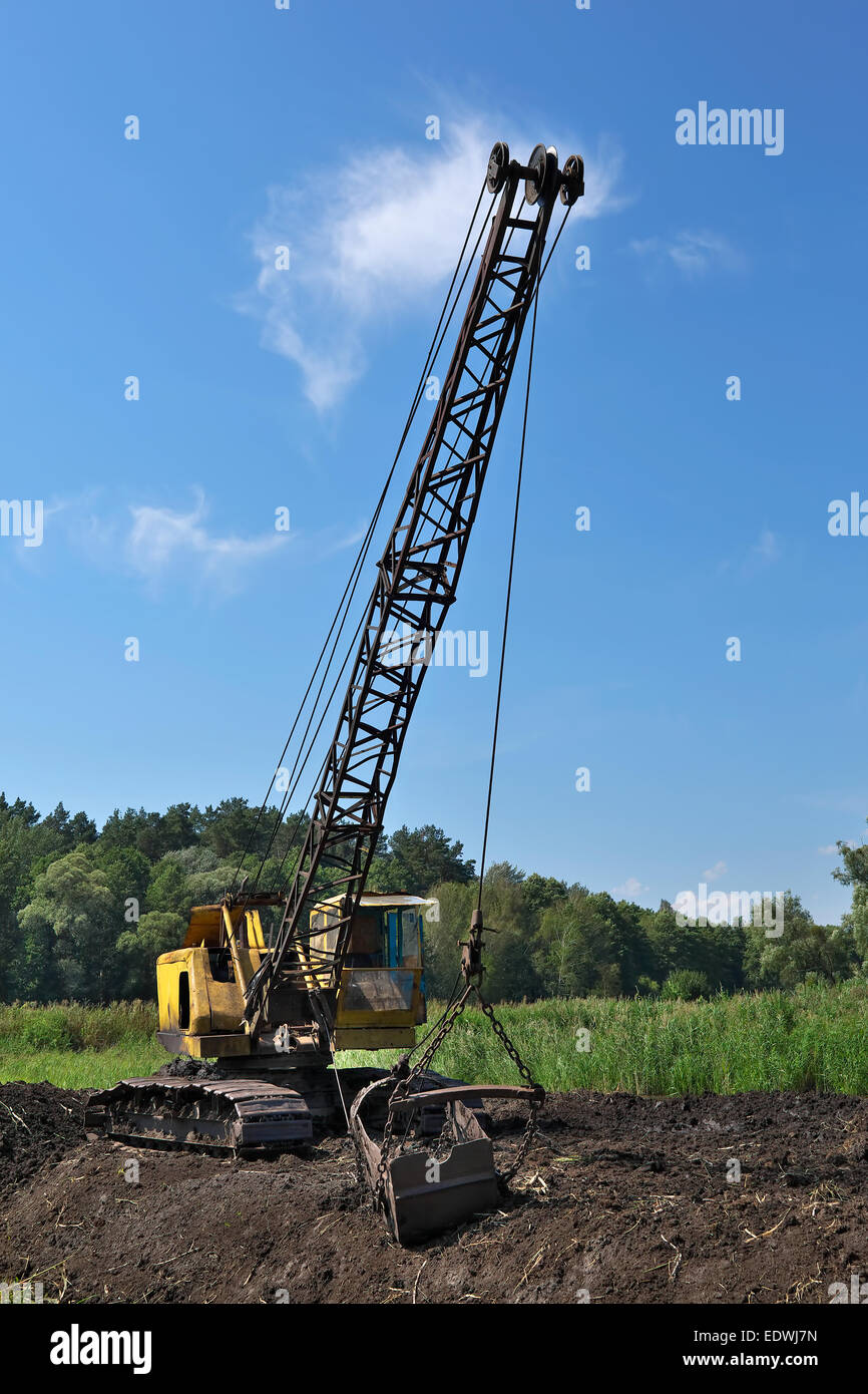 Old dragline mining the peat on the swamp Stock Photo - Alamy
