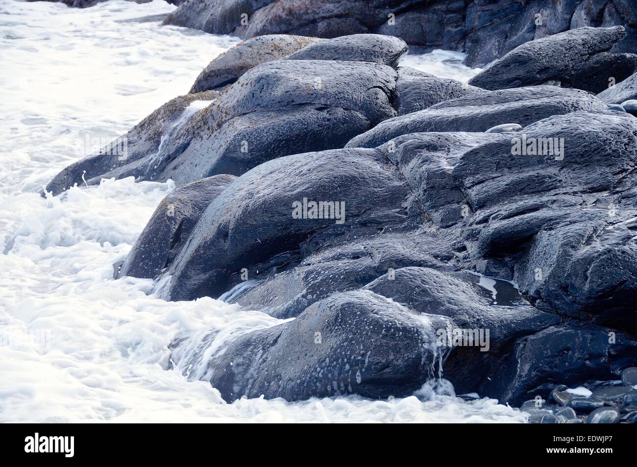 The hard rock closeup on the beach Stock Photo - Alamy