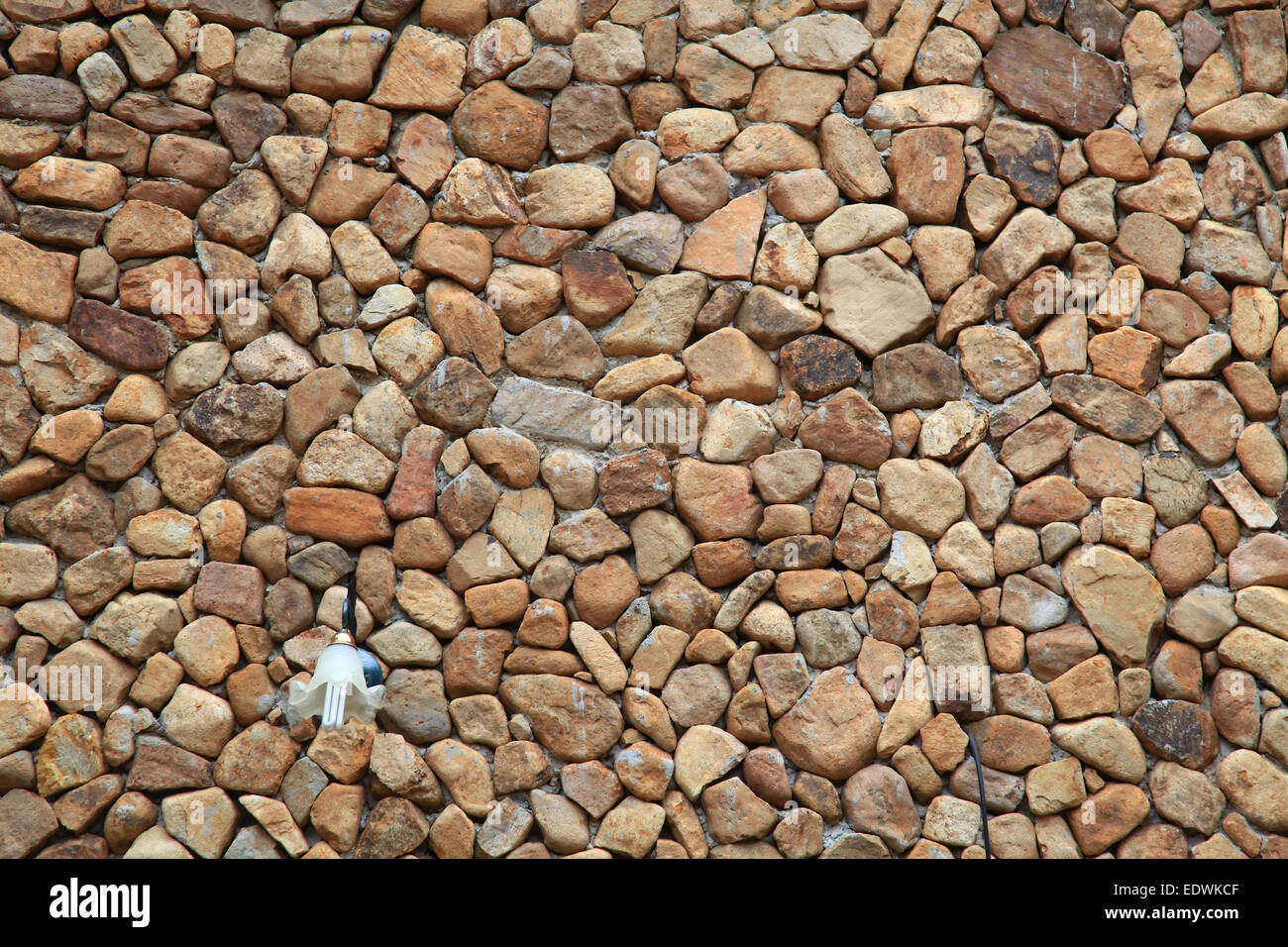 Traditional Stone Brick Wall made of fragment stones in irregular ...