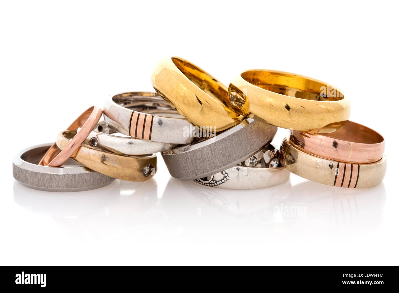 Golden and silver jewelry on the white background Stock Photo - Alamy