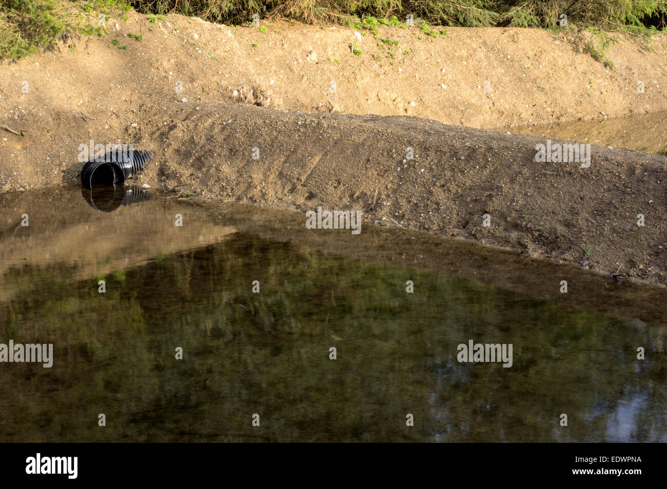 Pond dug on a feeder stream to a water supply reservoir, this will ...