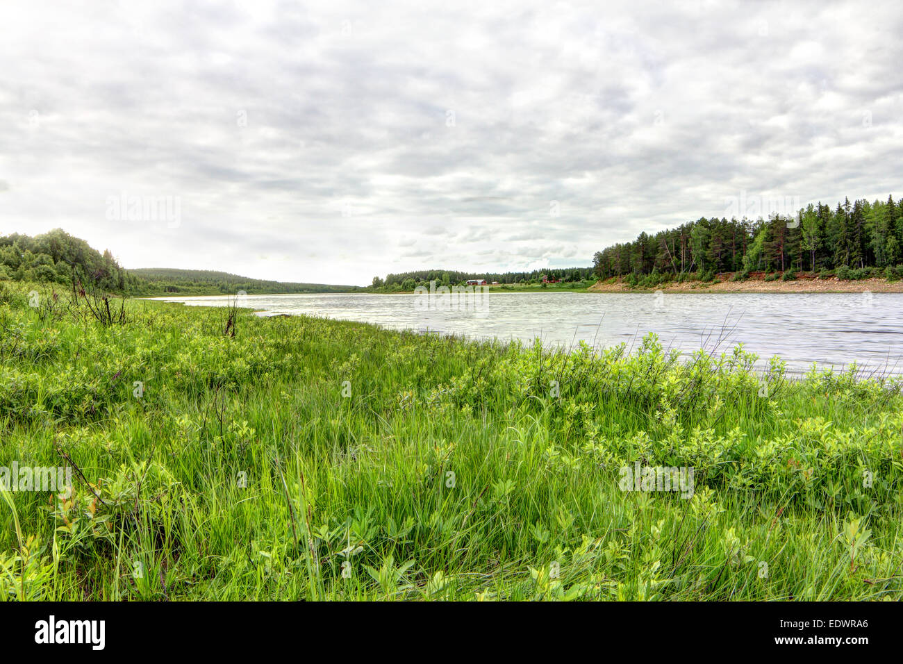 Picturesque landscape with forest and wide river Stock Photo - Alamy