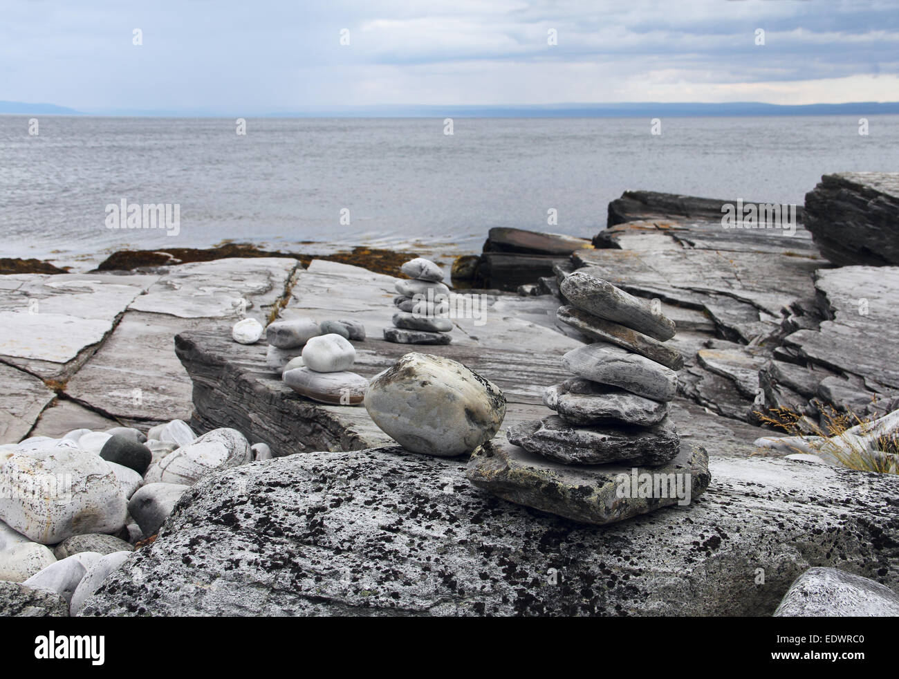 Stack of rocks on ocean coast of northern Norway fjord Stock Photo - Alamy