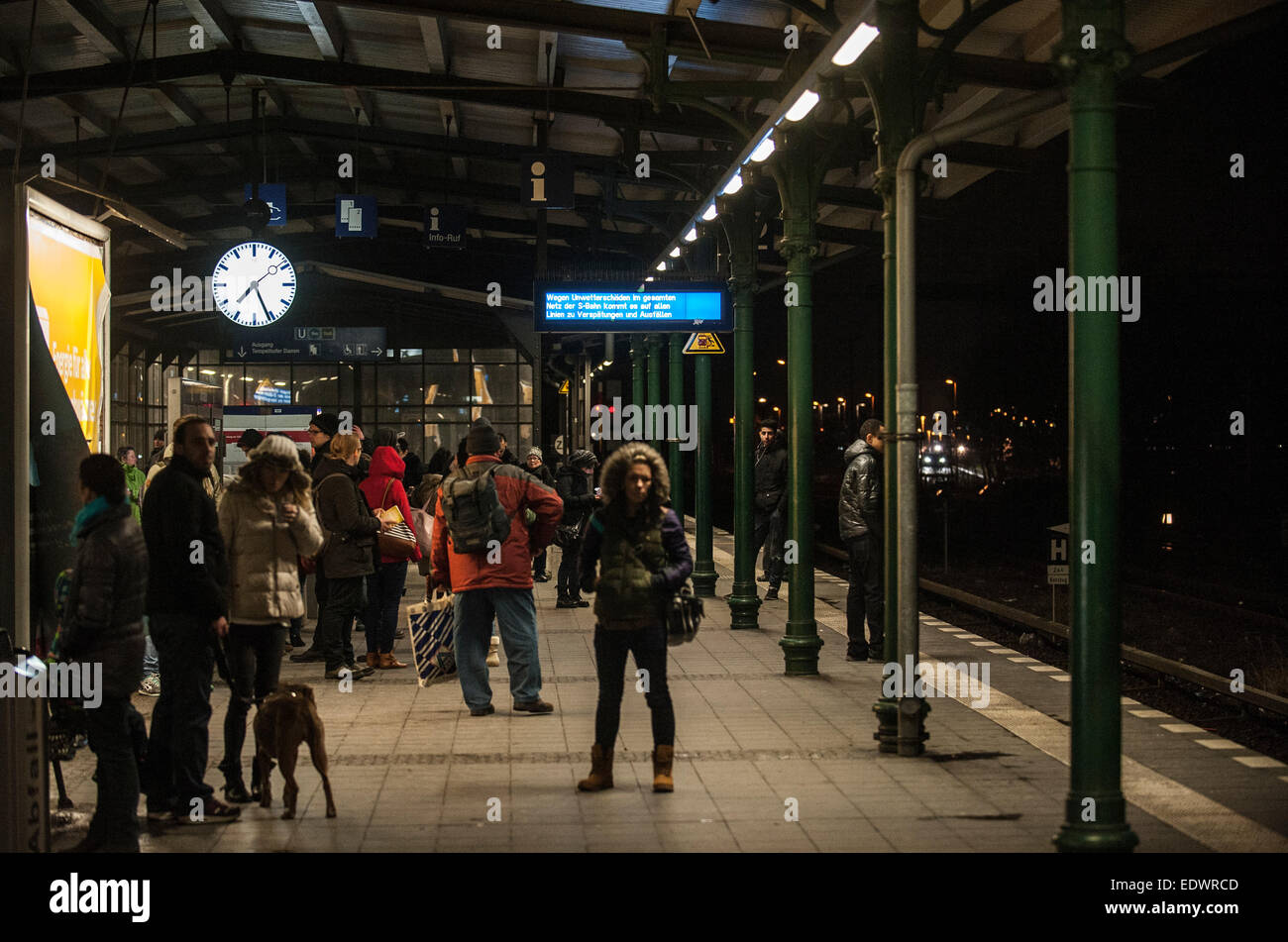 Passengers wait for their delayed train connections at the commuter ...
