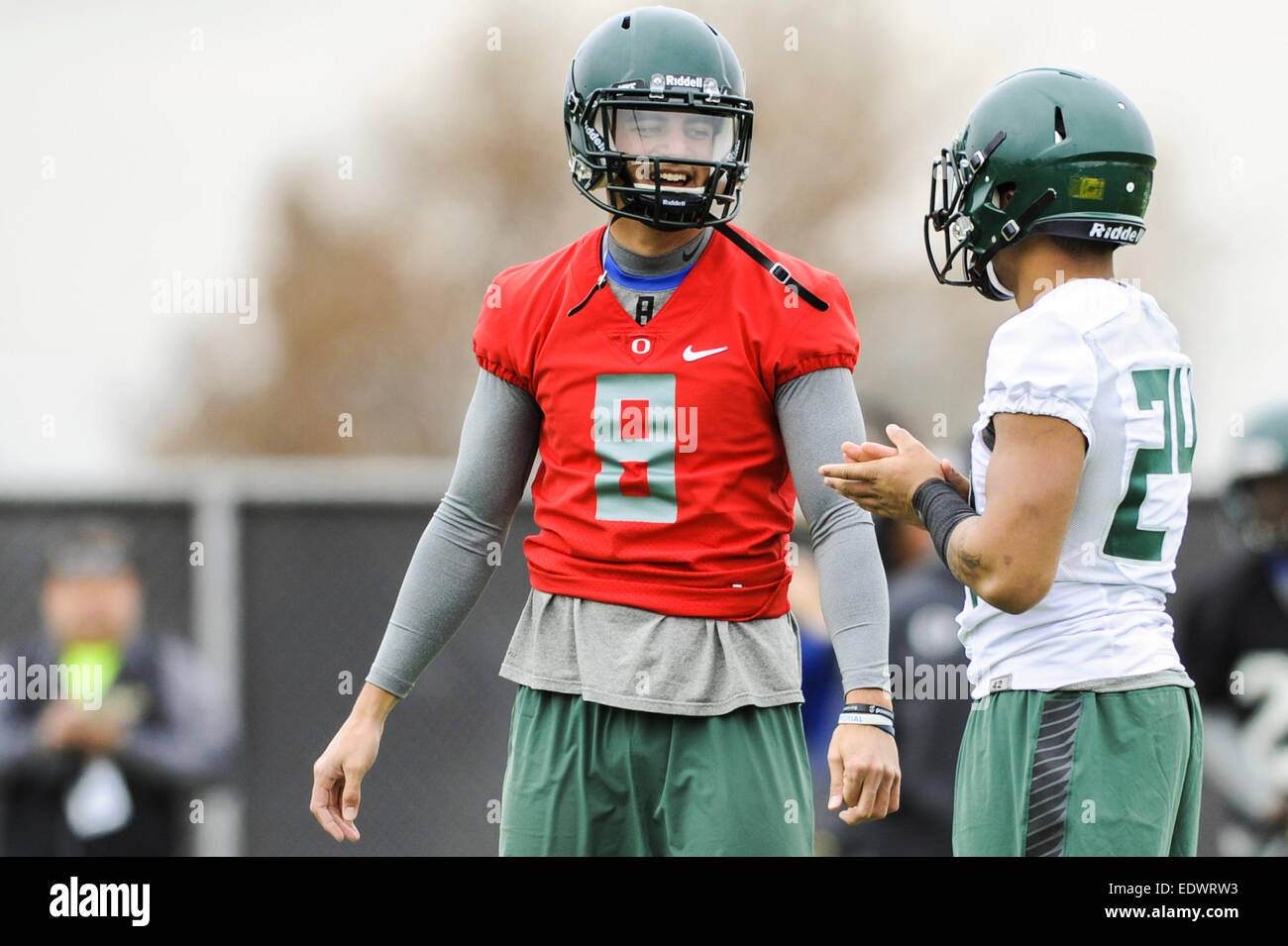 Oregon Ducks' quarterback Marcus Mariota has a laugh with running back ...
