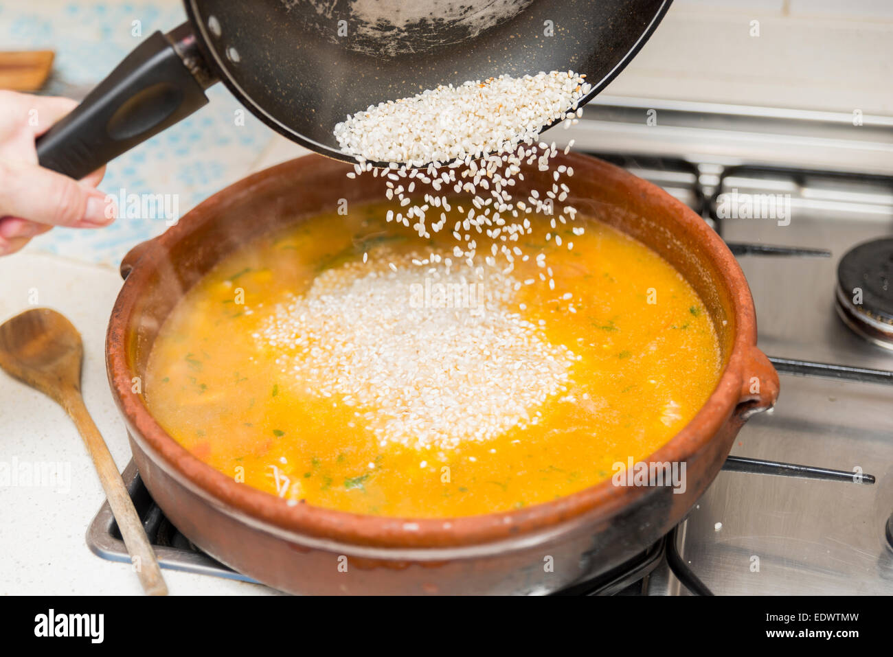 Valencian paella cooked seafood and rice Stock Photo - Alamy