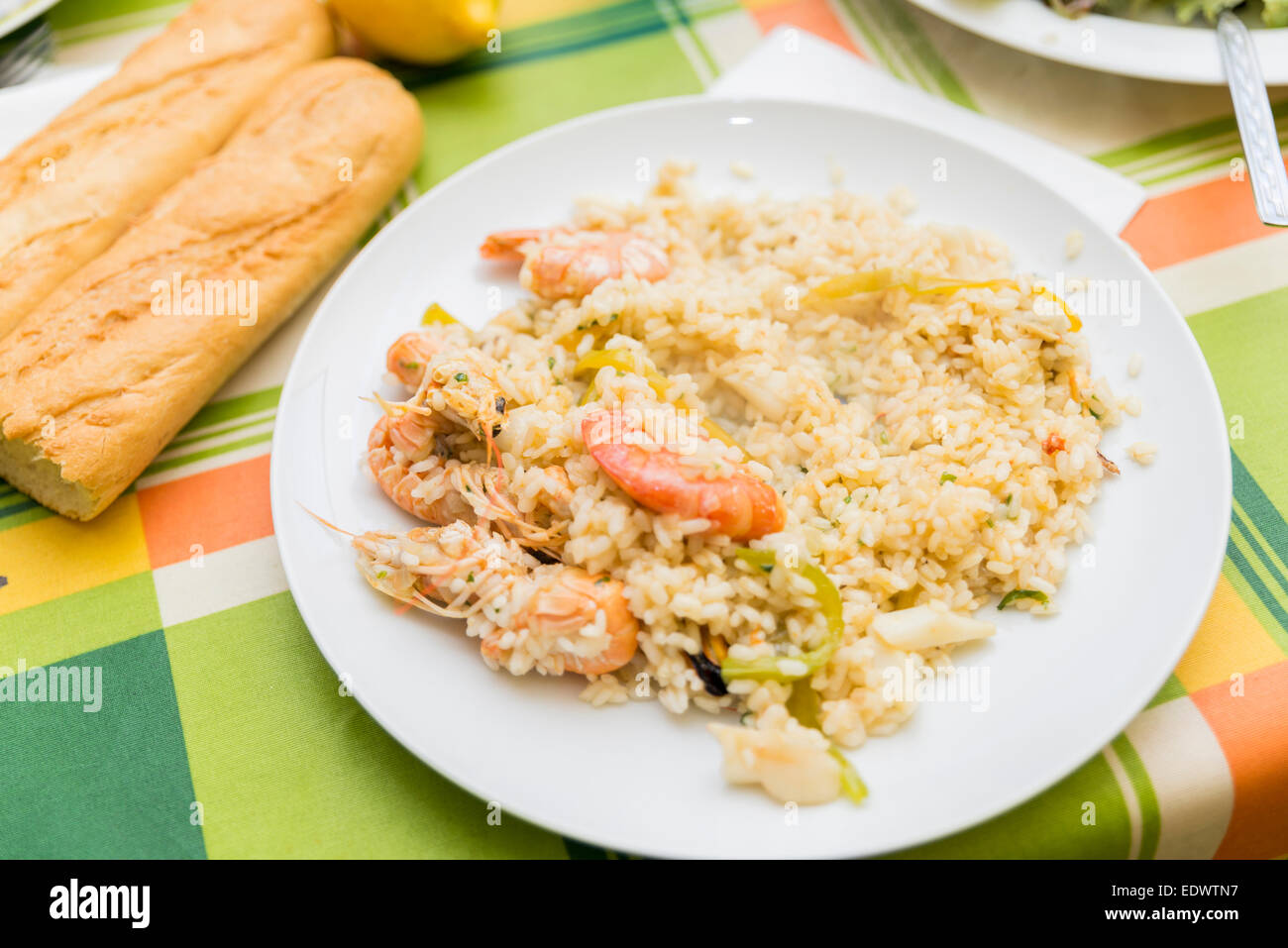 Valencian paella cooked seafood and rice Stock Photo - Alamy