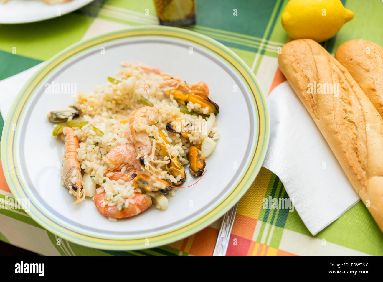 Valencian paella cooked seafood and rice Stock Photo - Alamy