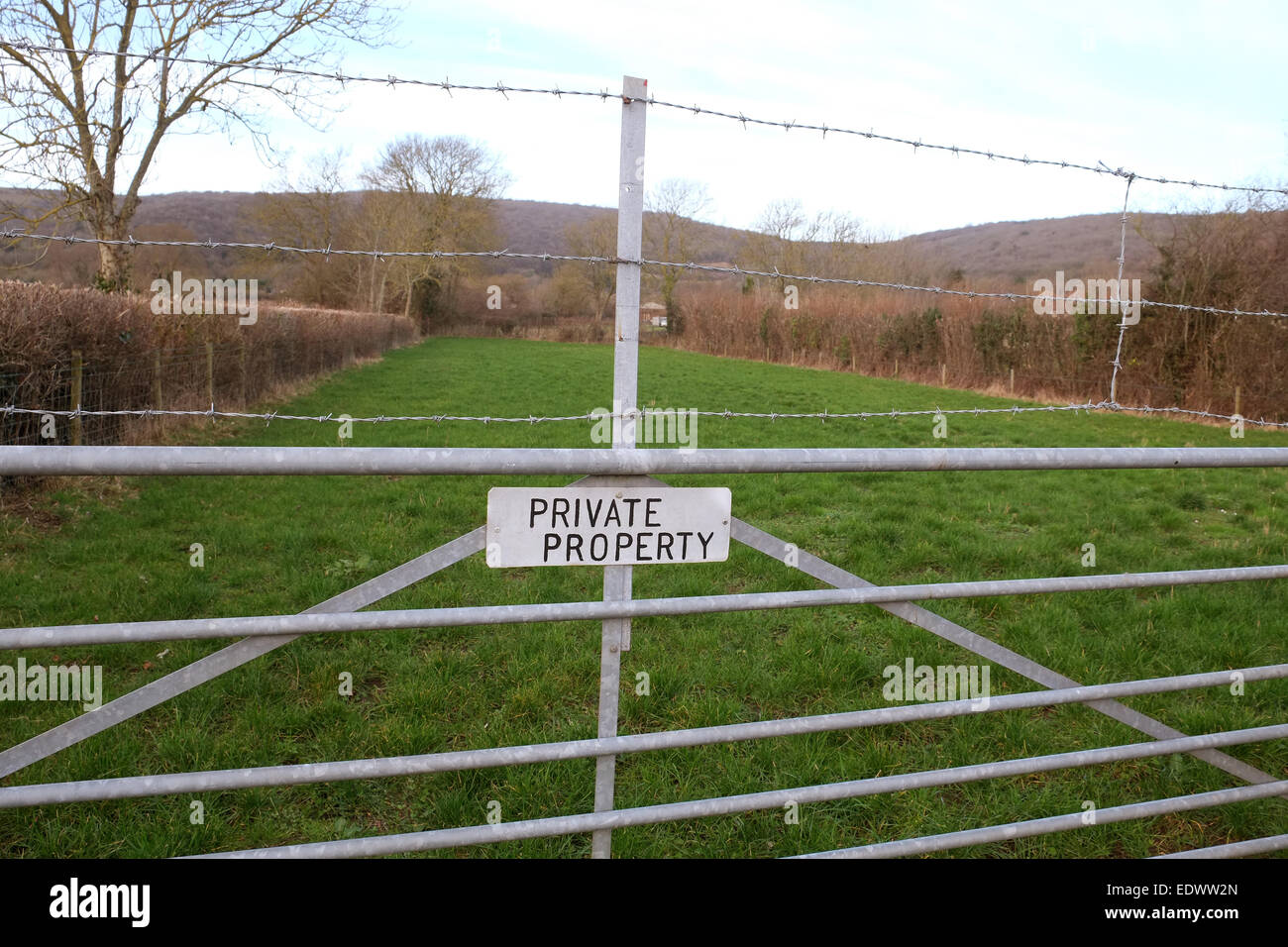Private property sign on a gate to an empty field in Cheddar, Somerset ...
