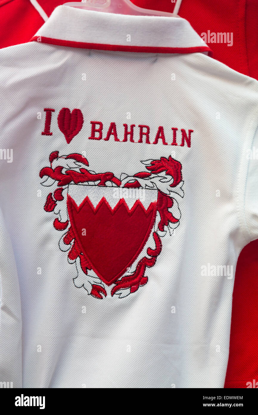 National colors of red and white on shirts hanging in store in Muharraq ...