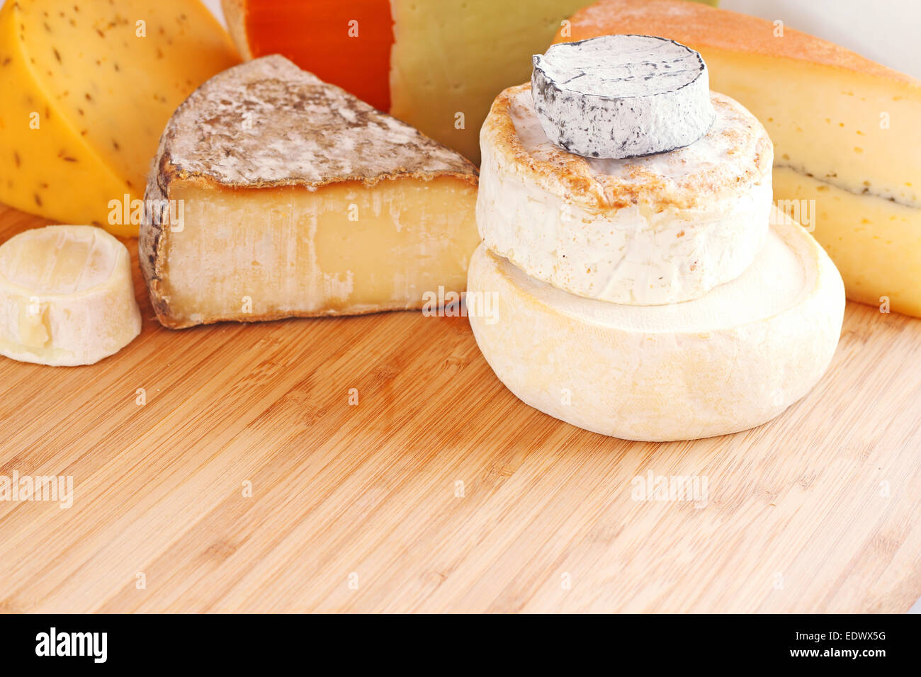 French cheese collection on wooden board with copy space Stock Photo ...