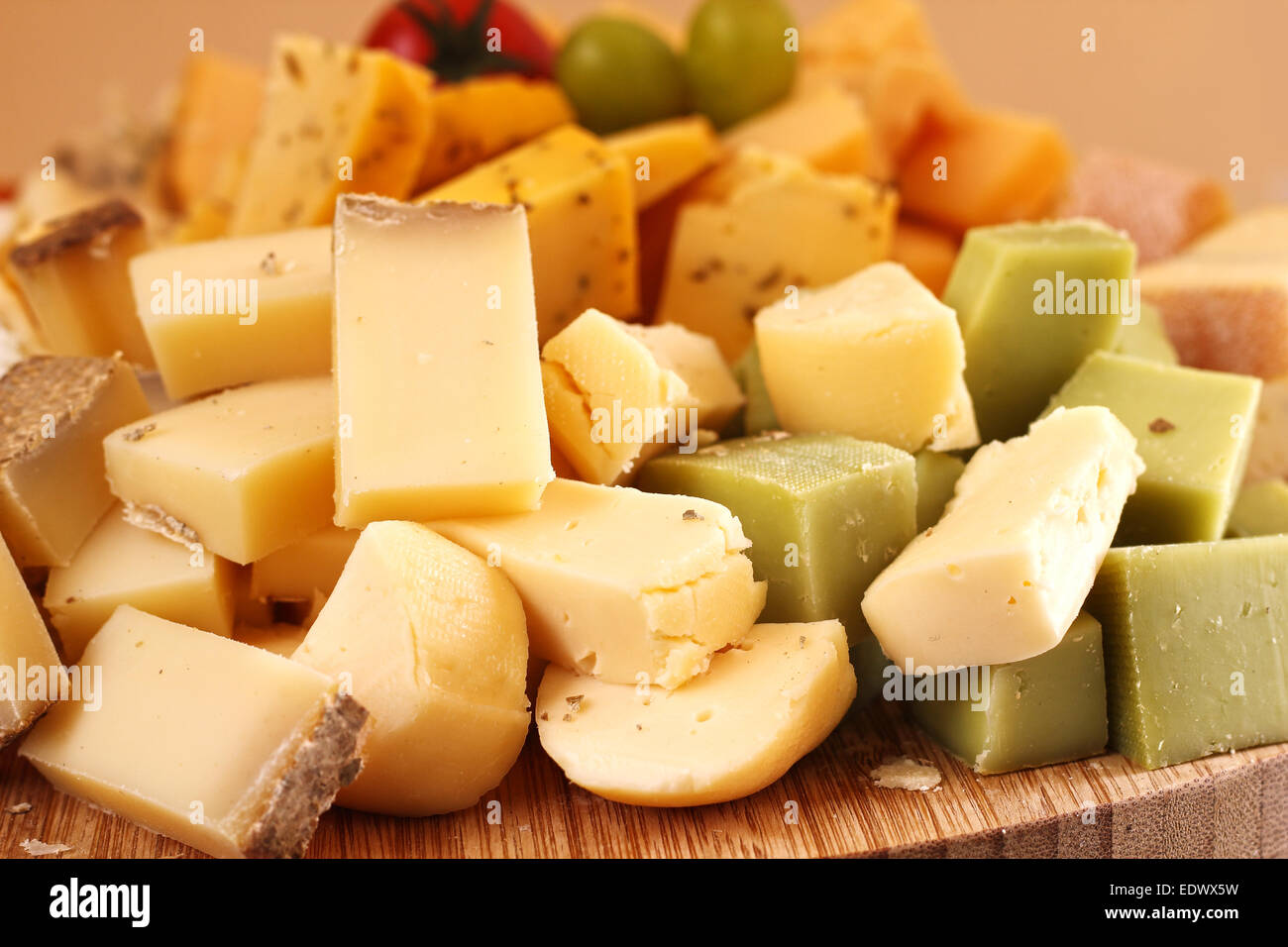Cut french cheese blocks background close-up Stock Photo - Alamy