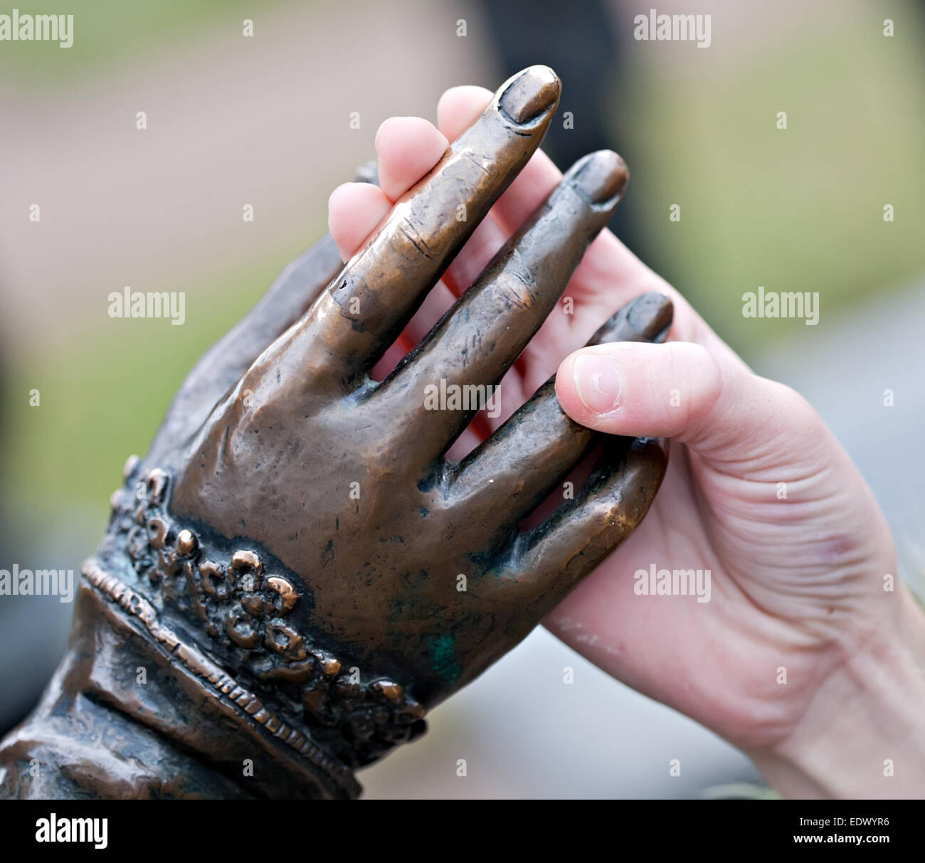 Child touching statue hi-res stock photography and images - Alamy