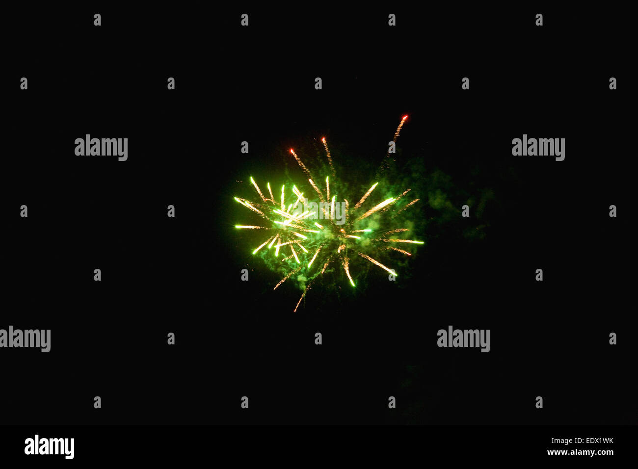 Green fireworks bursting in hi-res stock photography and images - Alamy