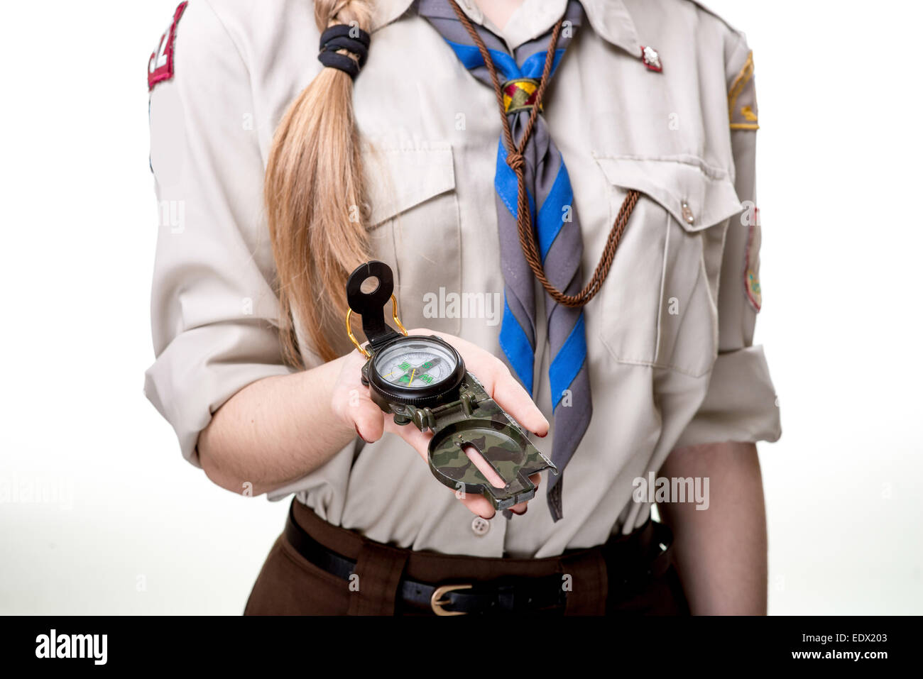 Girl scout holding the compass isolated on white background Stock Photo ...