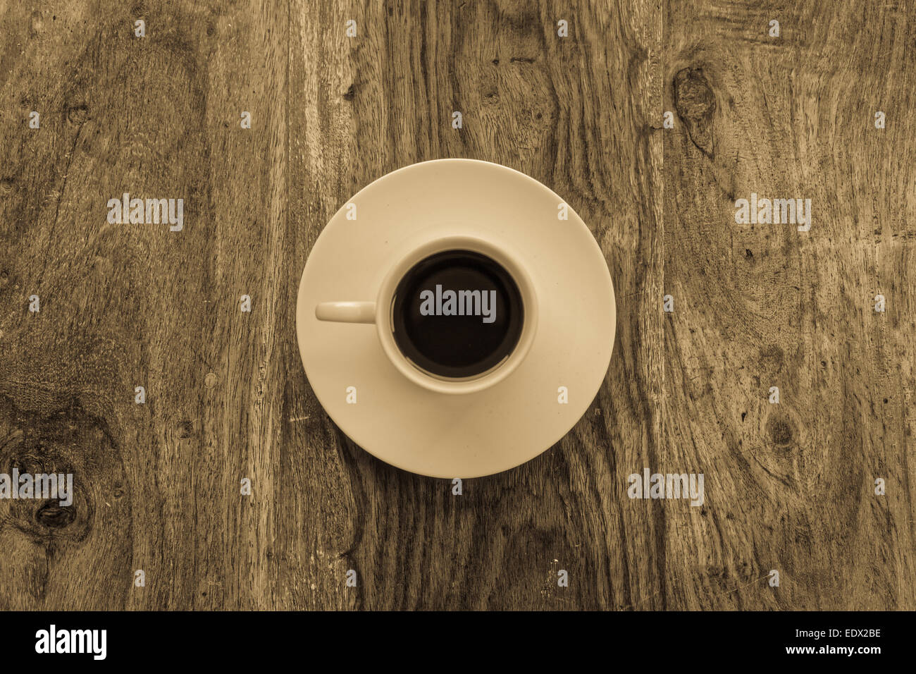 Coffee on timber table Stock Photo - Alamy