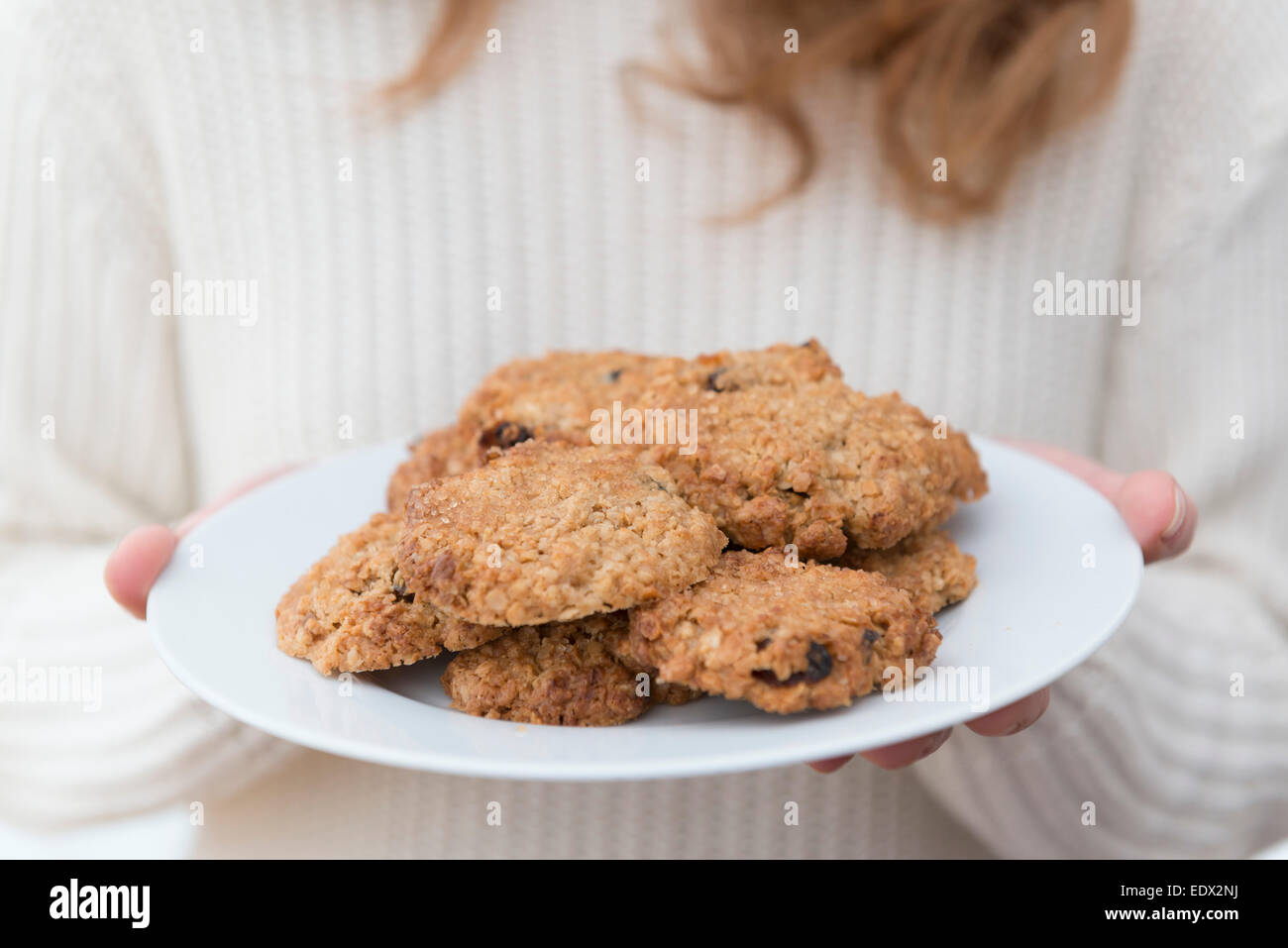 Woman holding a plate of mince meat cookies Stock Photo - Alamy