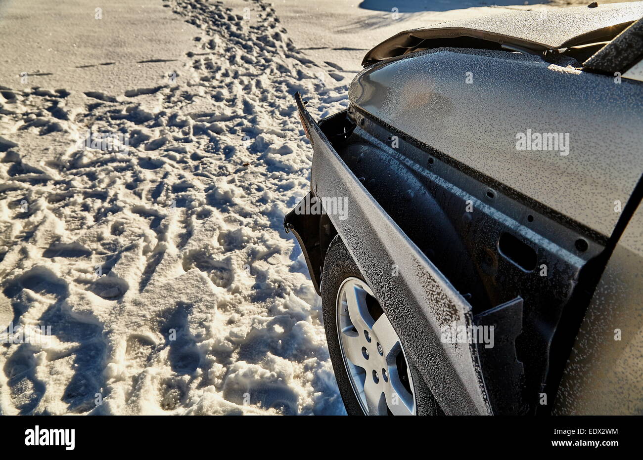 Crashed car with fender hanging off Stock Photo - Alamy